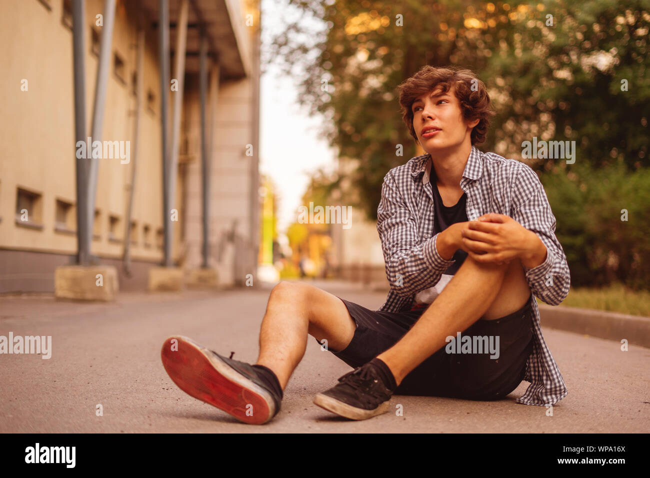 man on the ground, got injury outdoors, falling down Stock Photo - Alamy