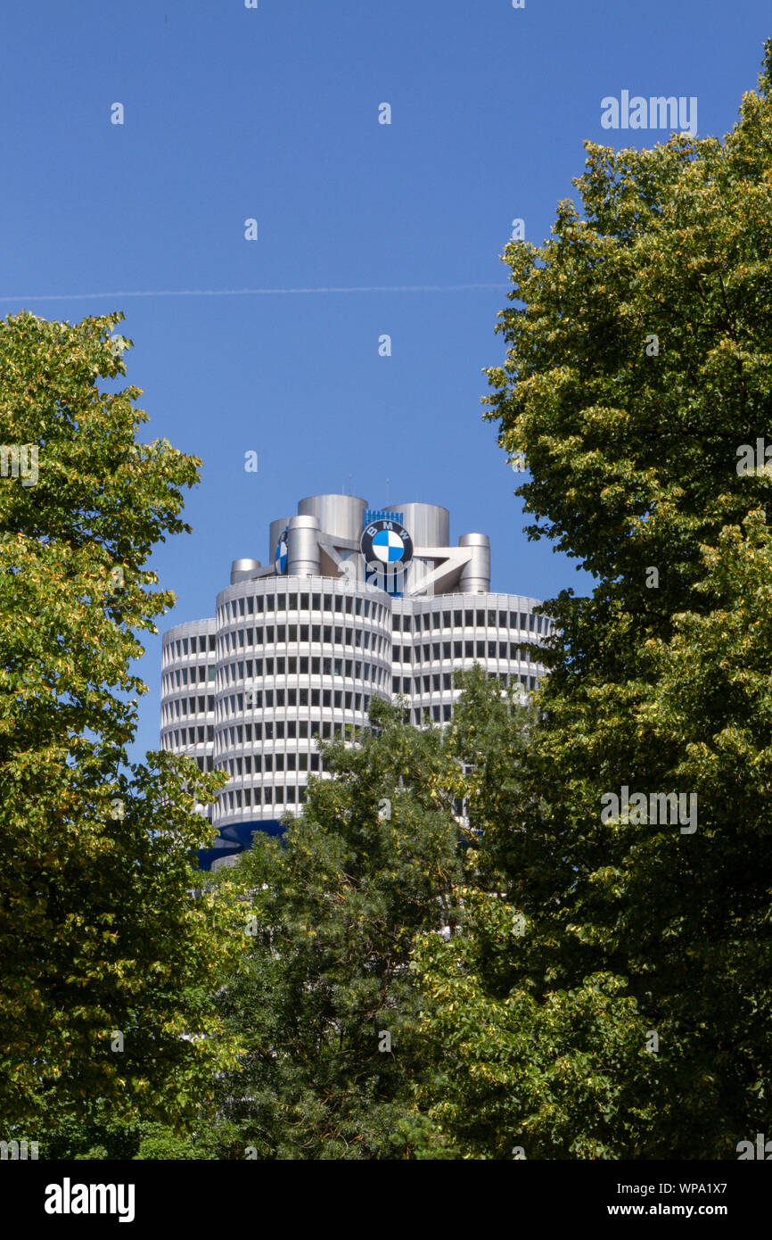 The BMW Tower viewed through trees, BMW Headquarters, Munich, Bavaria ...