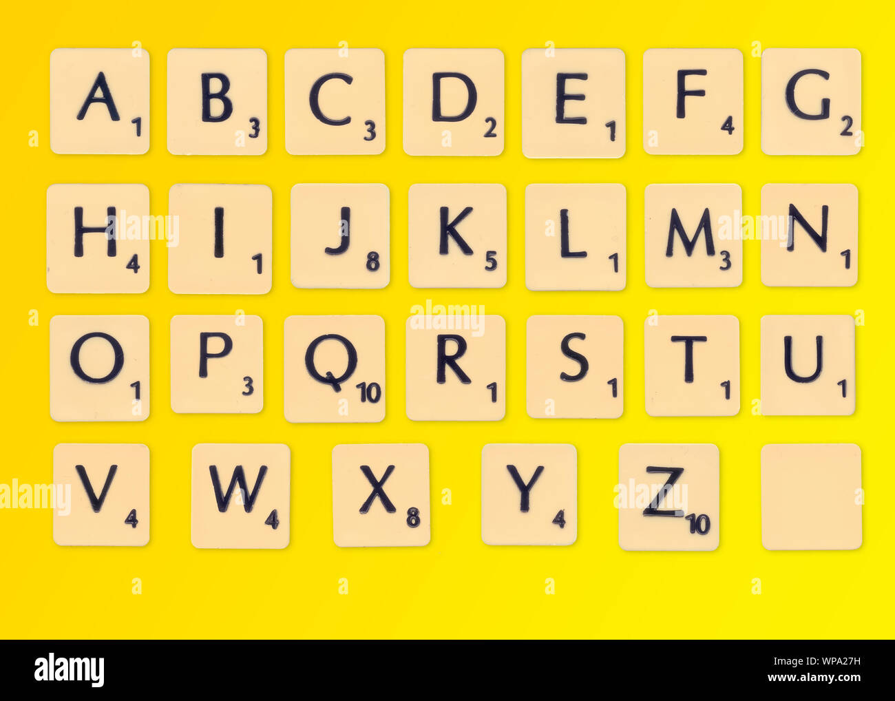 Digitally created image of a full alphabet of scrabble tiles on a ...