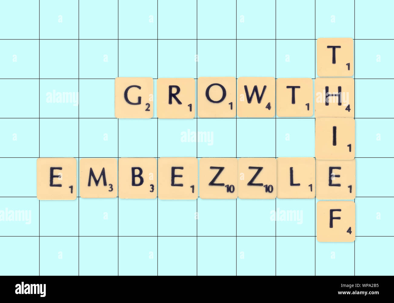 Spelling out words with scrabble tiles hi-res stock photography and ...