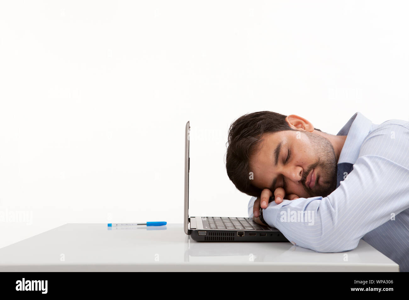 Businessman sleeping on laptop Stock Photo - Alamy