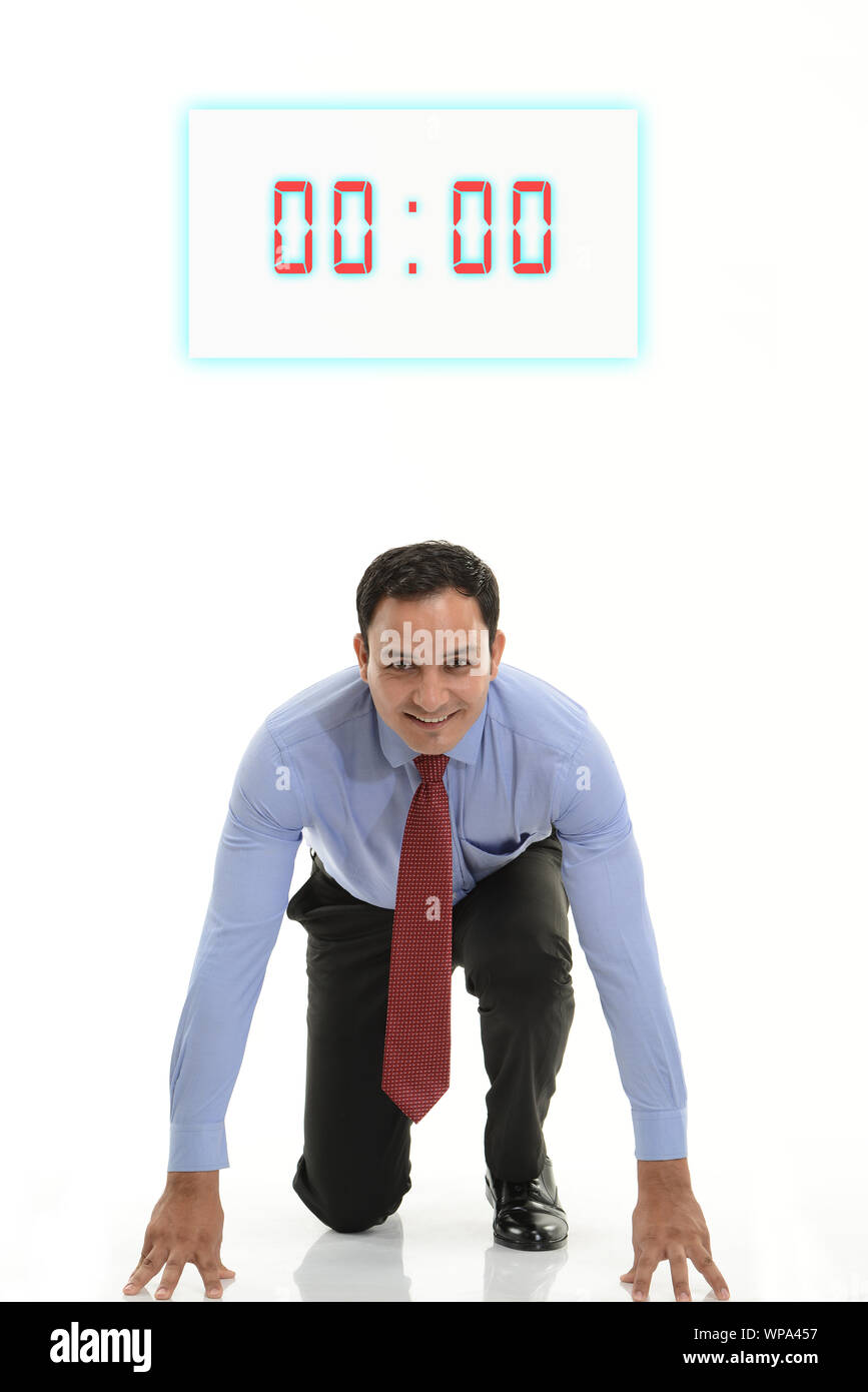 Businessman in race start position Stock Photo - Alamy