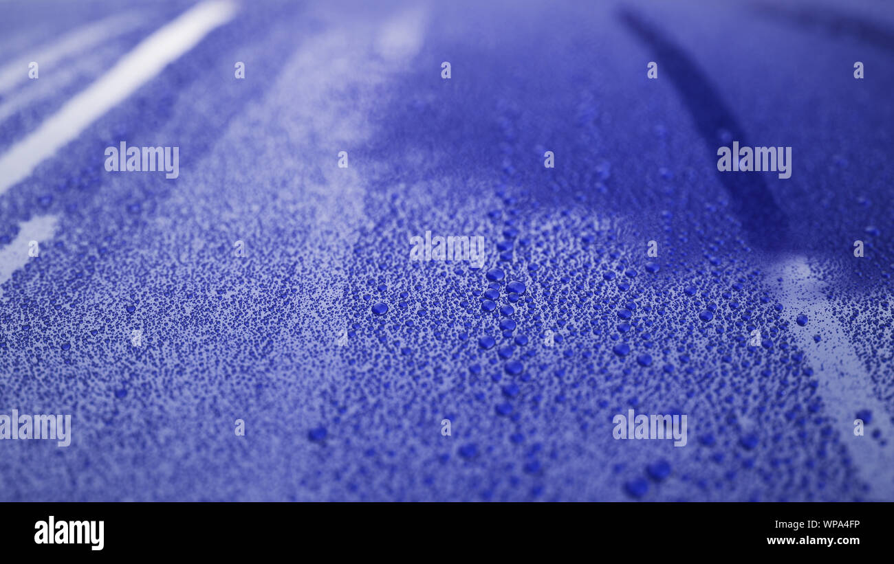 Closeup blue car paint surface with hydrophobic ceramic coating ...
