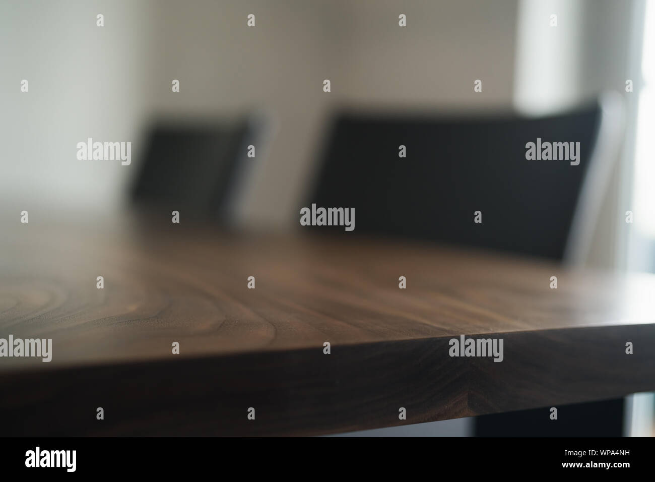 Closeup walnut dining table with copy space, shallow focus Stock Photo ...