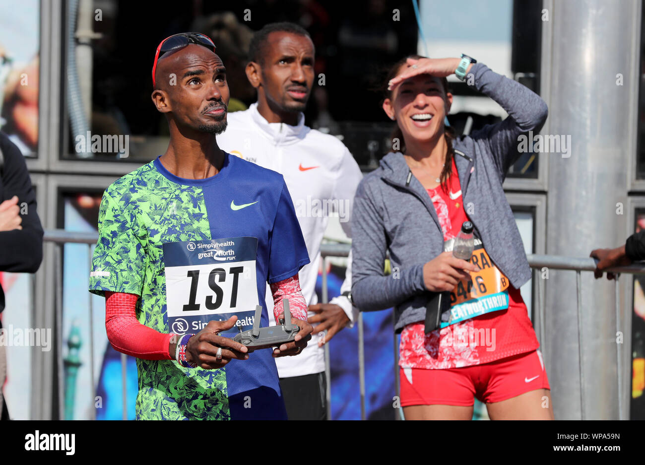 Sir Mo Farah (left) and wife Tania Farah after completing the 2019 ...