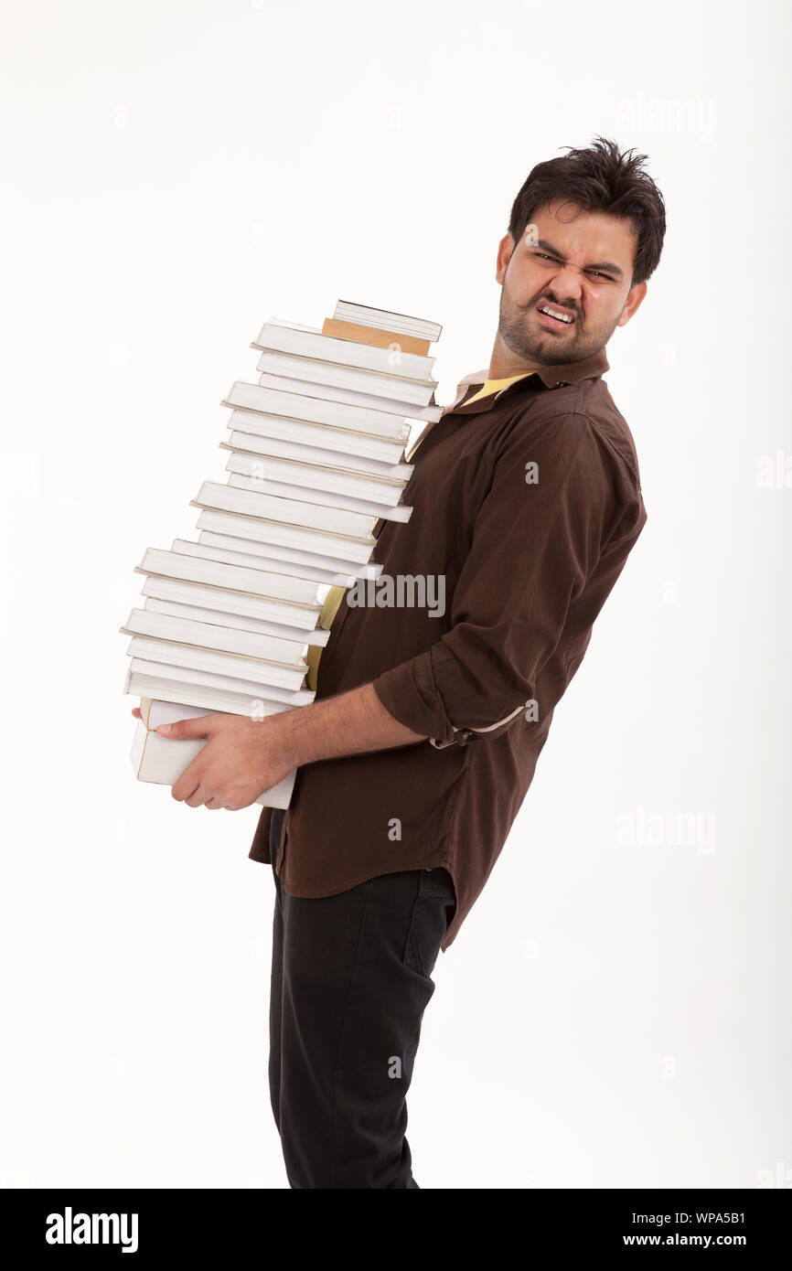 College student carrying stack of books Stock Photo - Alamy College student carrying stack of books Stock Photo - Alamy