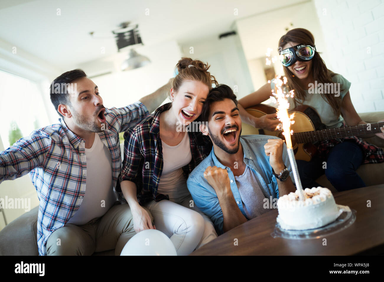 Young group of happy friends celebrating birthday Stock Photo - Alamy