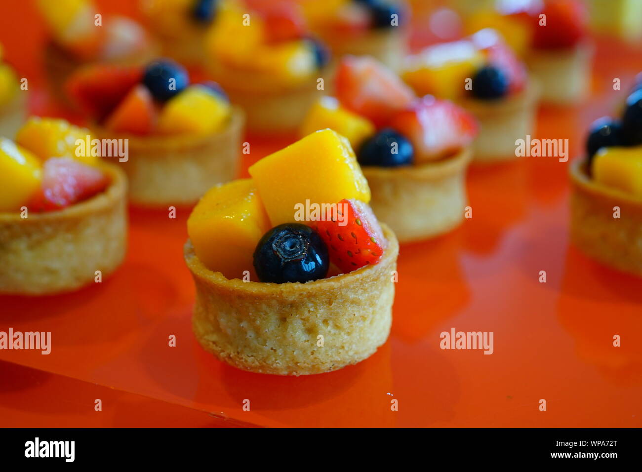 Mini fruit tartlets with fresh berry fruit Stock Photo - Alamy
