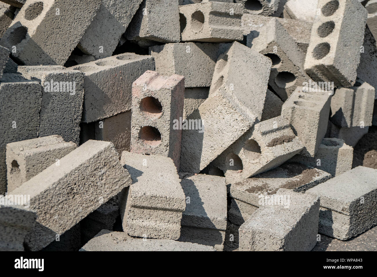 stacks of gray concrete blocks on the ground. Building Stock Photo - Alamy