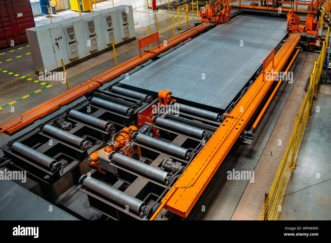 Steel sheet moving on roller conveyor in metalworking workshop Stock ...