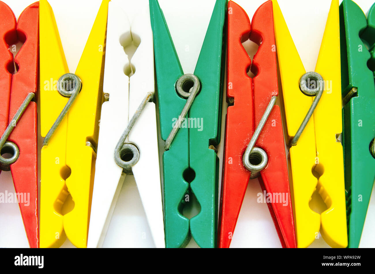 colorful clothes pegs in a row Stock Photo - Alamy
