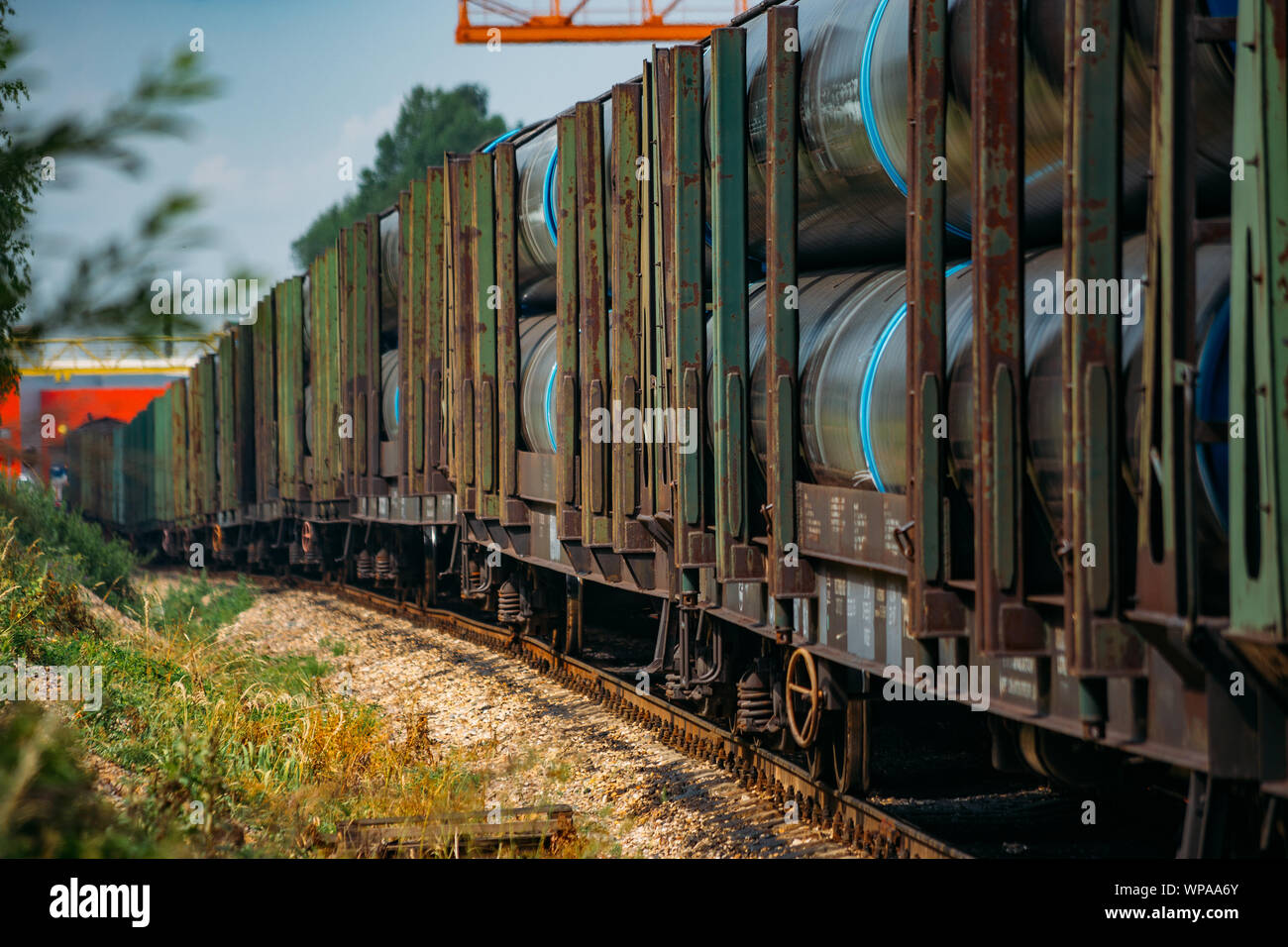 Freight train with new manufactured pipes selective focus Stock Photo ...