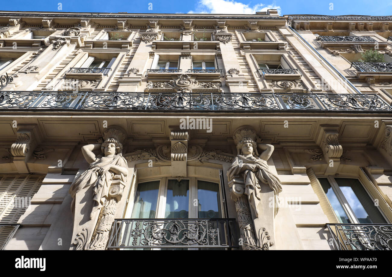 Traditional French house with typical balconies and windows. Paris ...