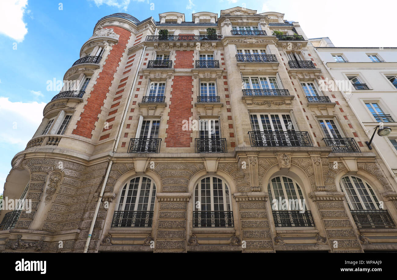 Traditional French house with typical balconies and windows. Paris ...