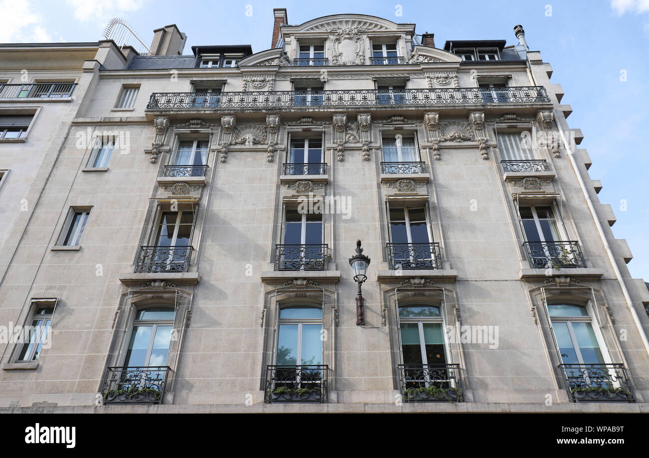 Traditional French house with typical balconies and windows. Paris ...