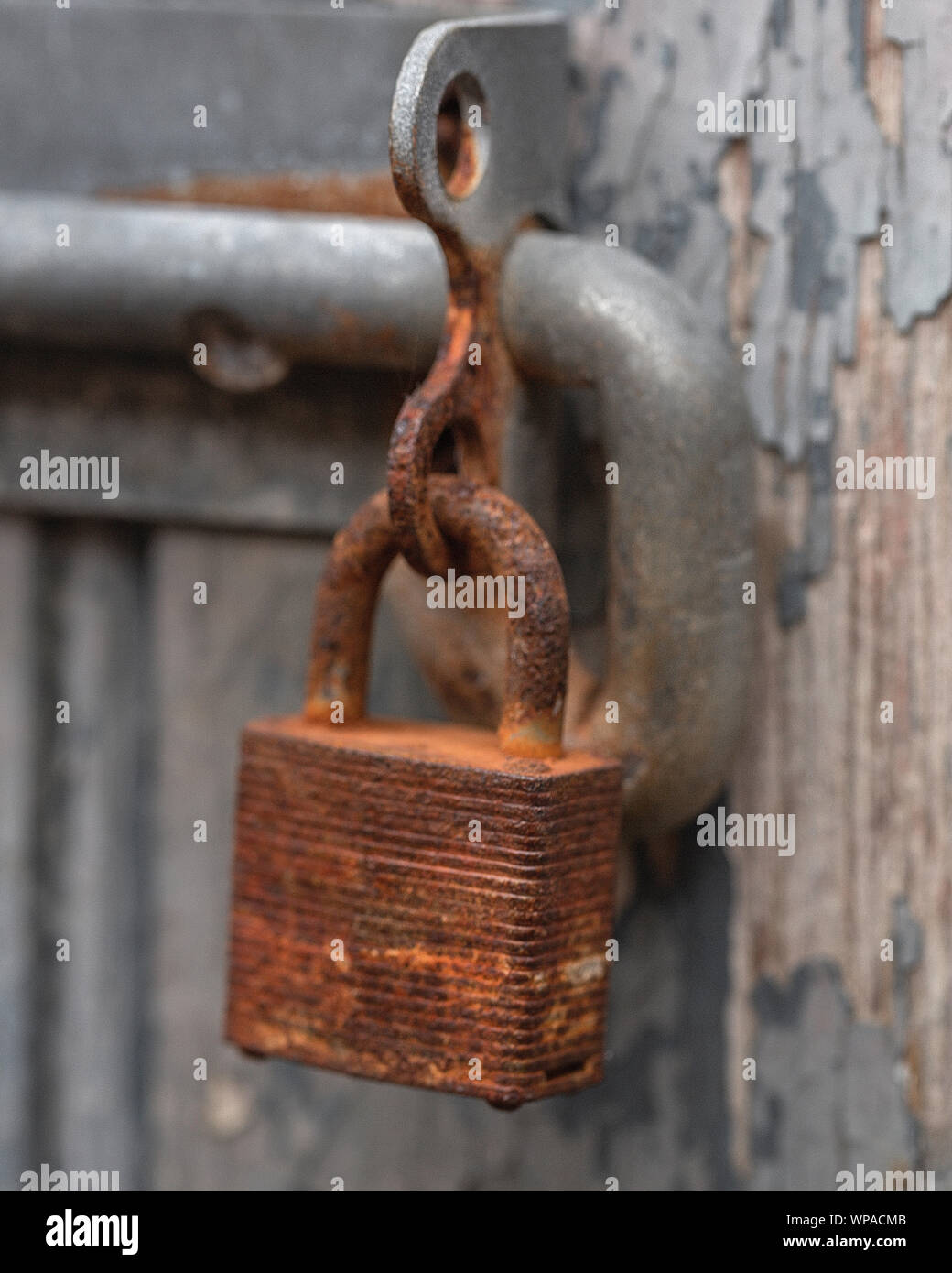 Rusty old door locker from metal Stock Photo - Alamy