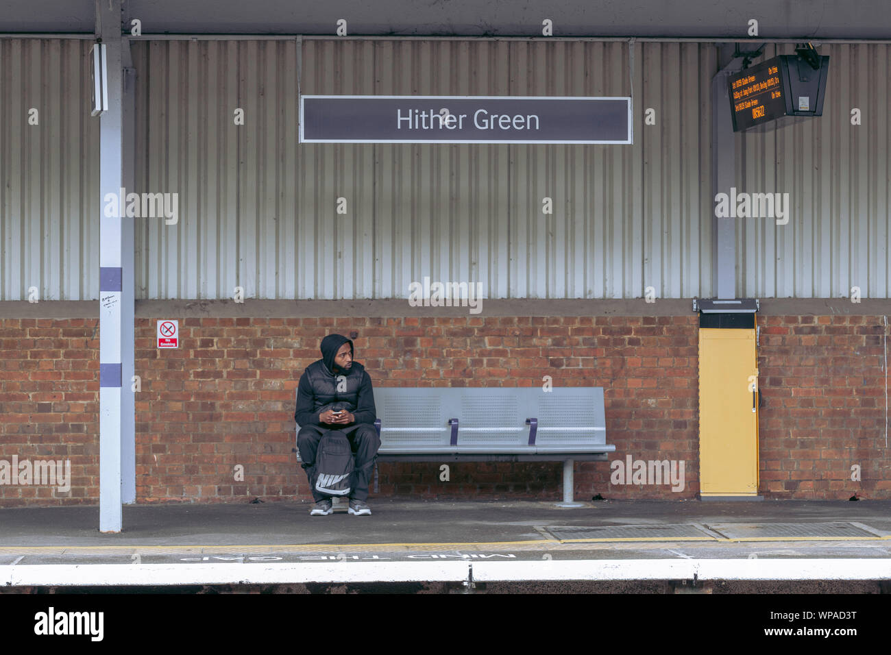 Man waiting for the train in London Heather Green station Stock Photo ...