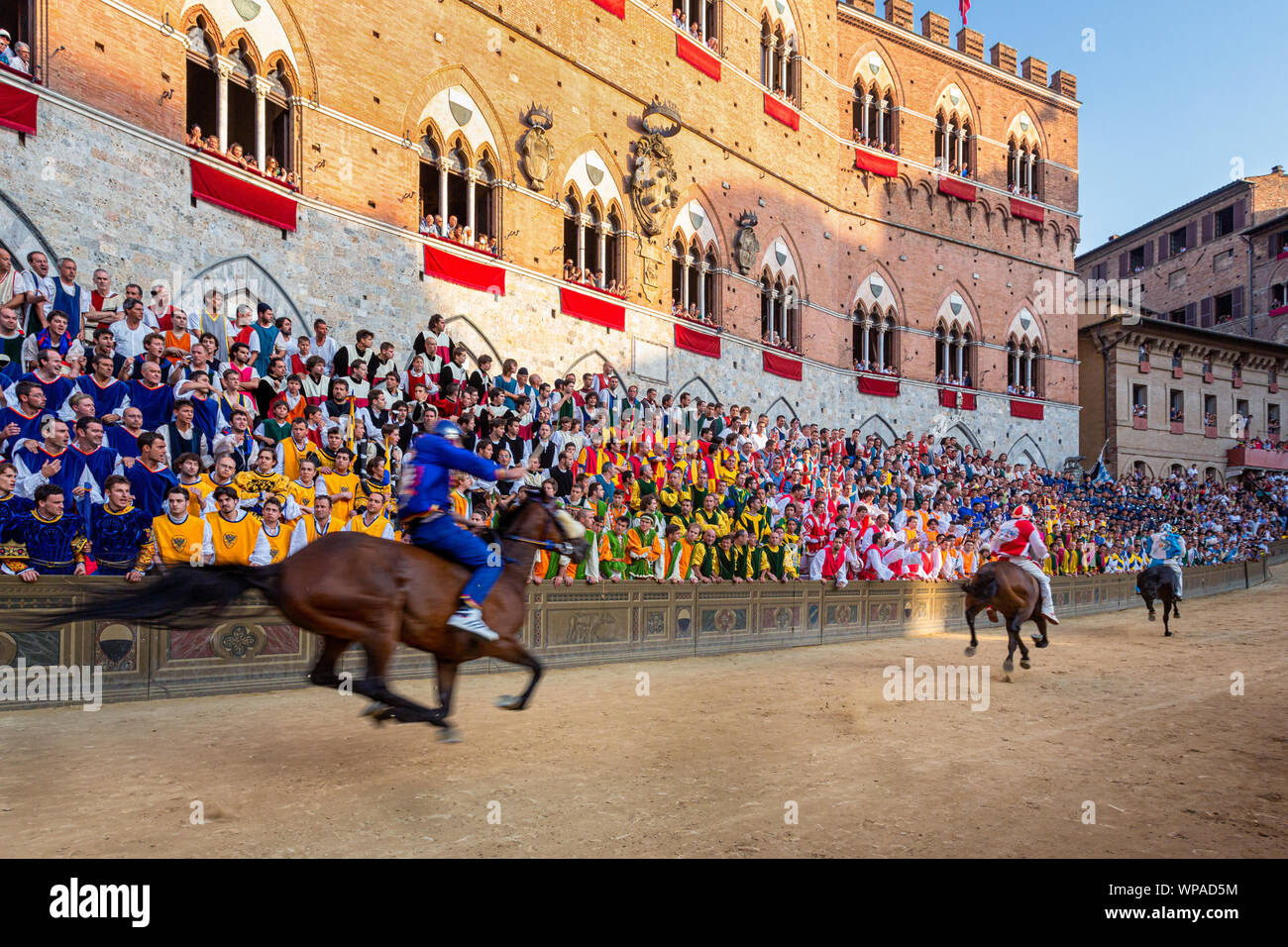 The Palio di Siena horse race on Piazza del Campo, Siena, Tuscany ...