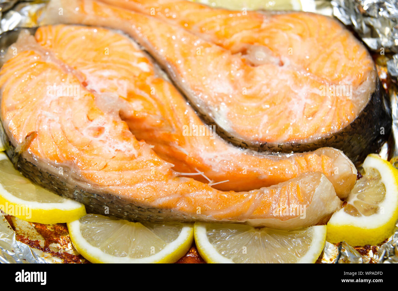 red fish with lemon cooked in foil Stock Photo - Alamy