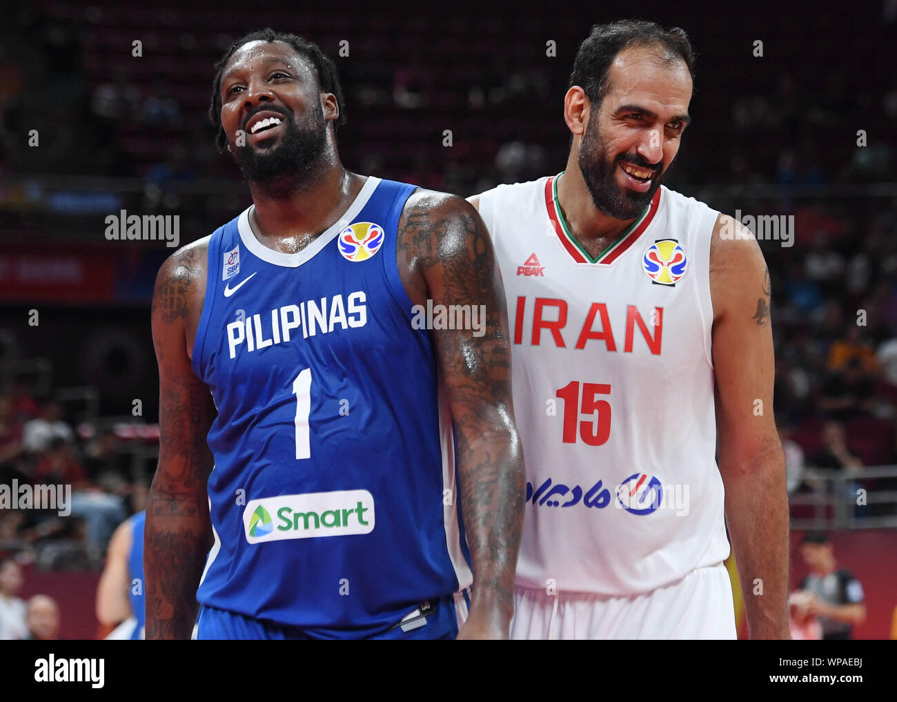 Beijing, China. 8th Sep, 2019. Hamed Haddadi (R) of Iran communicates ...