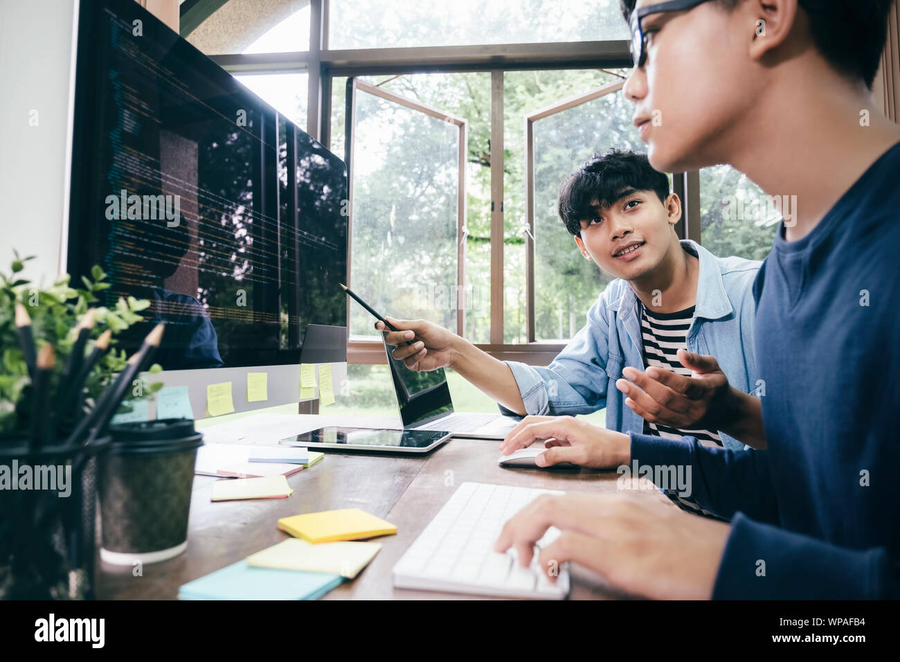 Programmers And Developer Teams Are Coding And Developing Software