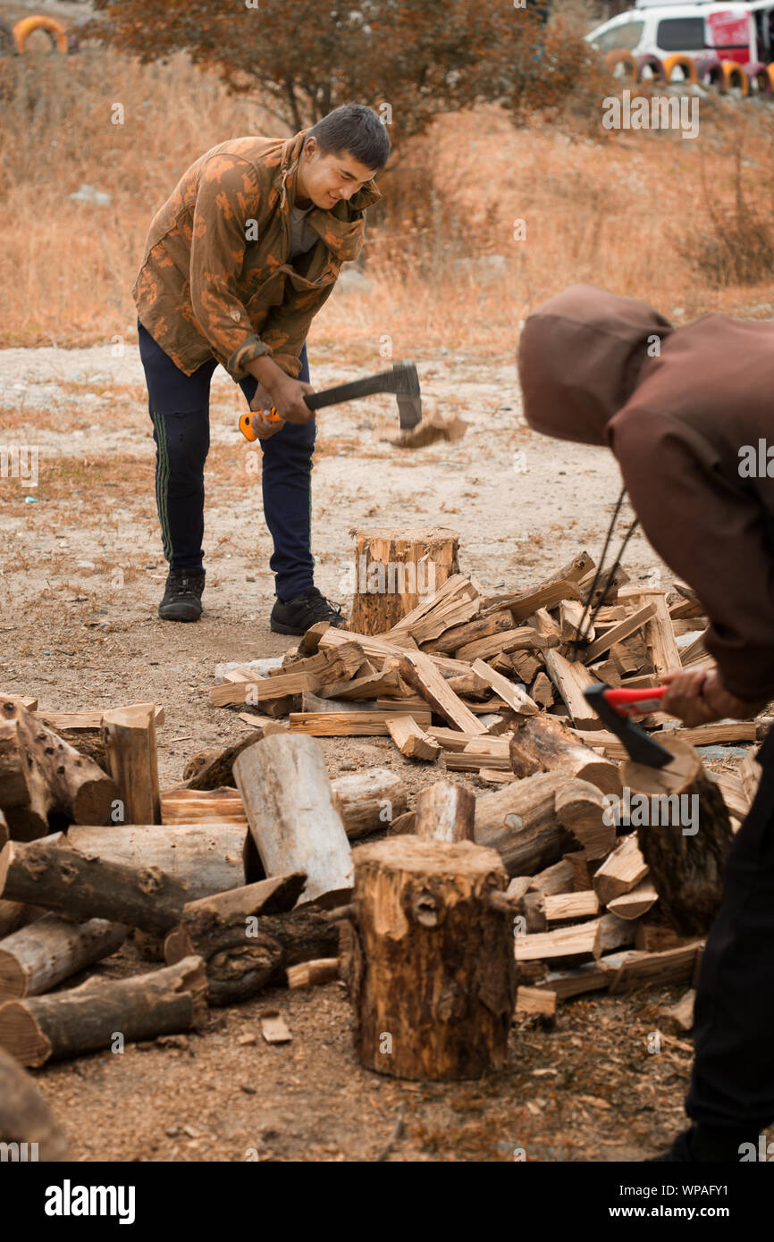 Man choping wood in the forest Stock Photo - Alamy