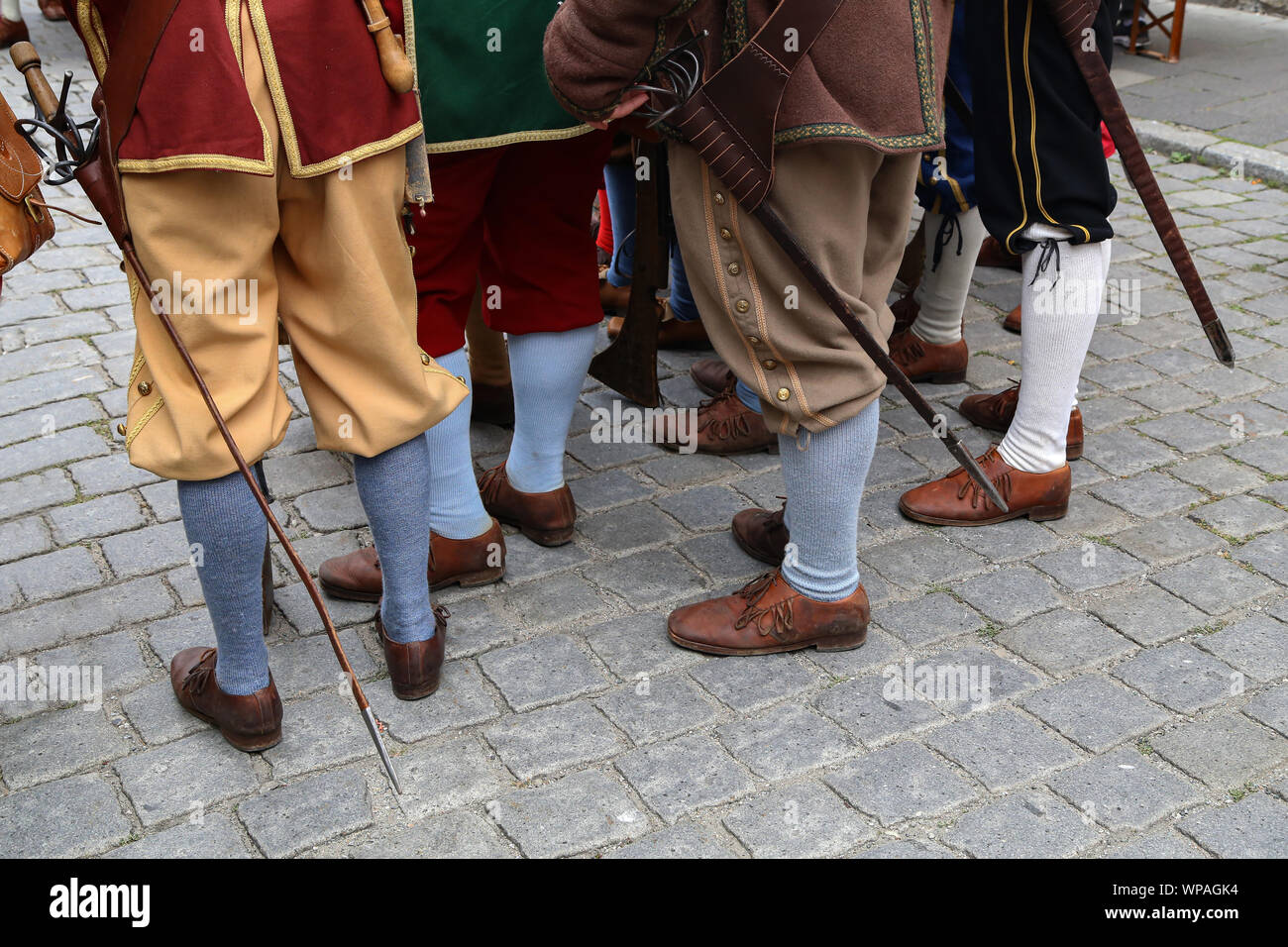 Reconstructors in musketeers clothes on a city holiday Stock Photo - Alamy
