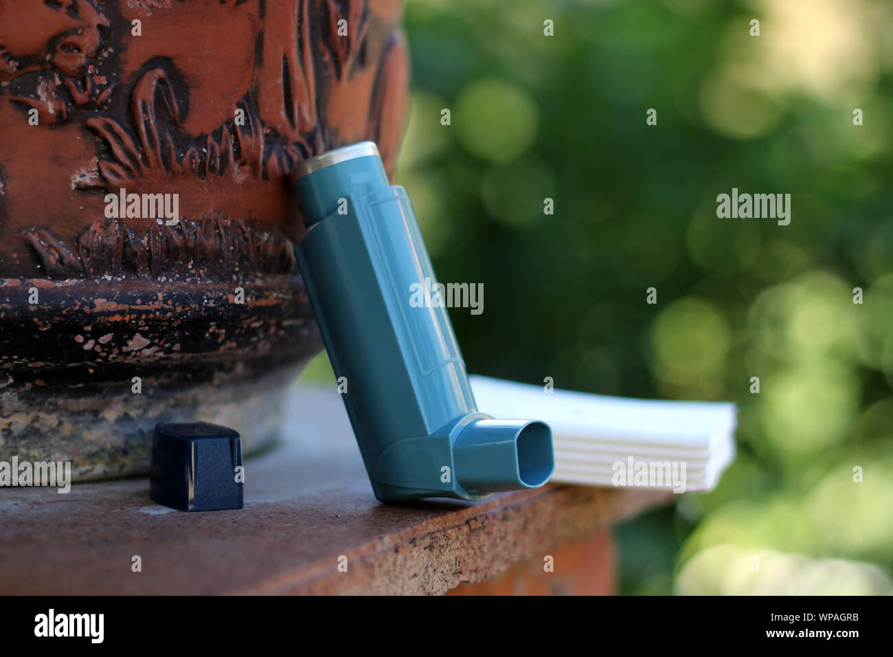 Medicine and health concept: Blue inhaler. Pharmaceutical product for ...