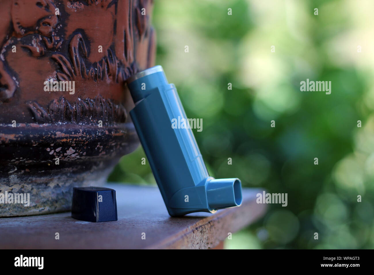 Medicine and health concept: Blue inhaler. Pharmaceutical product for ...