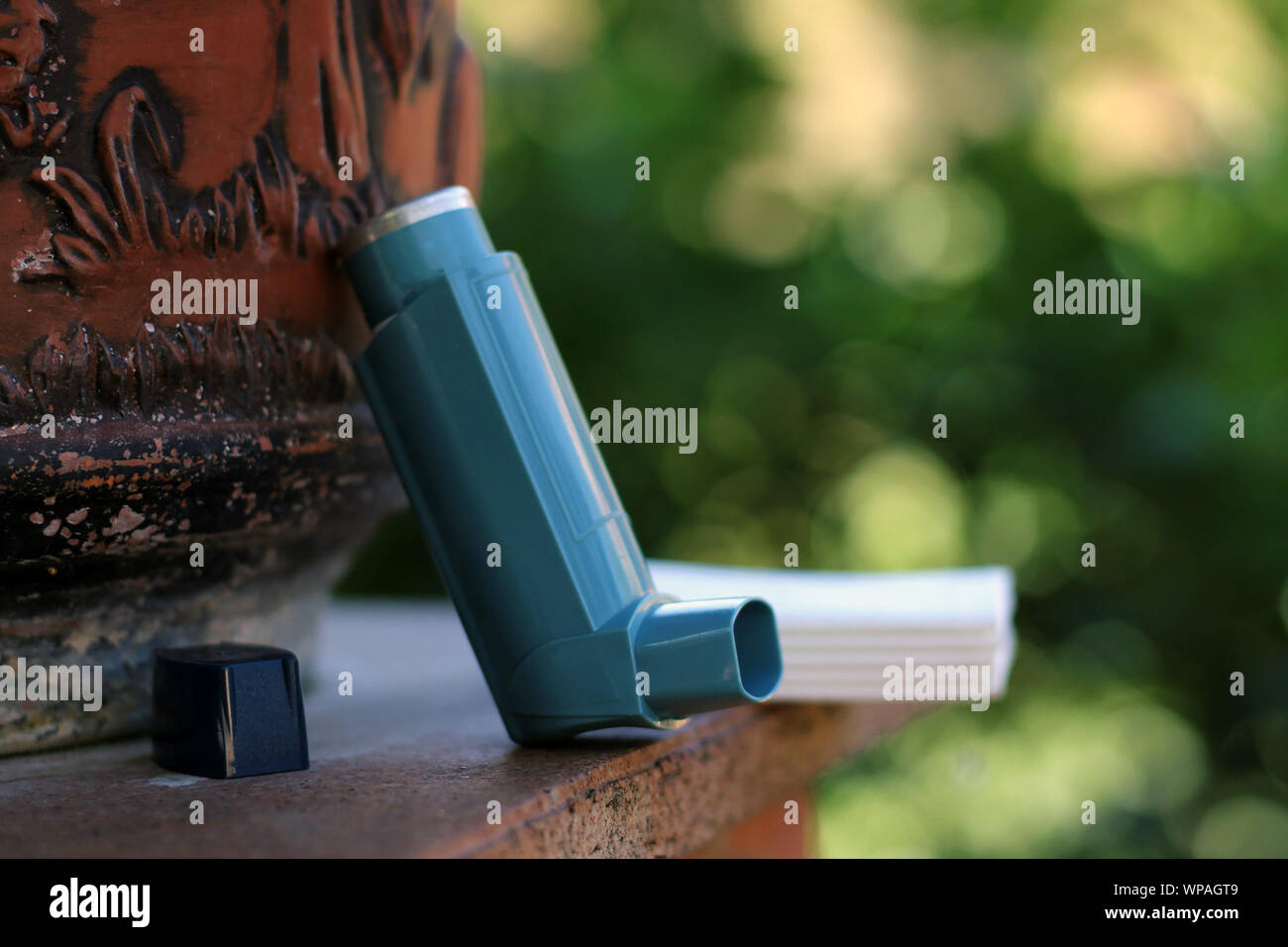 Medicine and health concept: Blue inhaler. Pharmaceutical product for ...