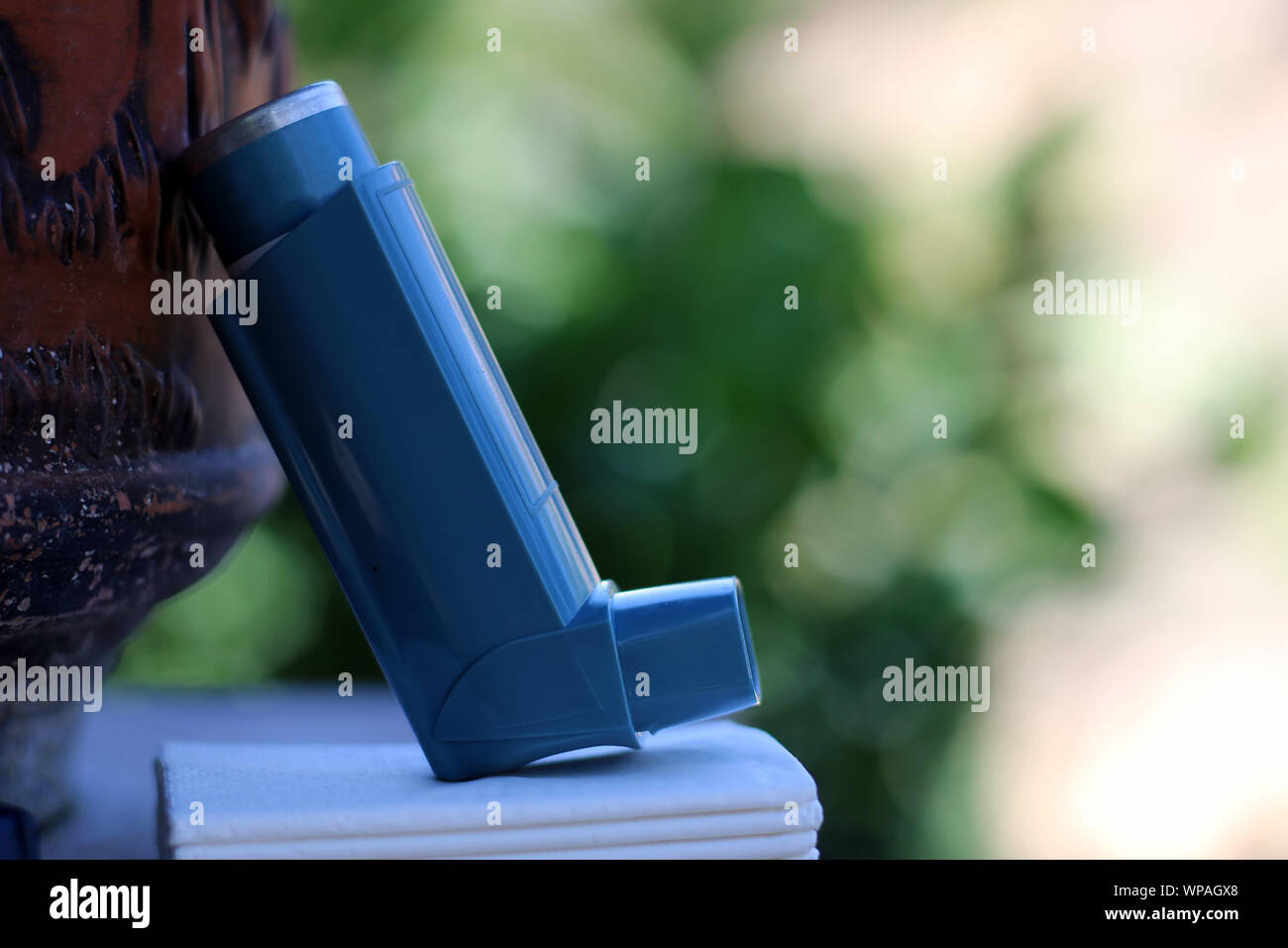 Medicine and health concept: Blue inhaler. Pharmaceutical product for ...