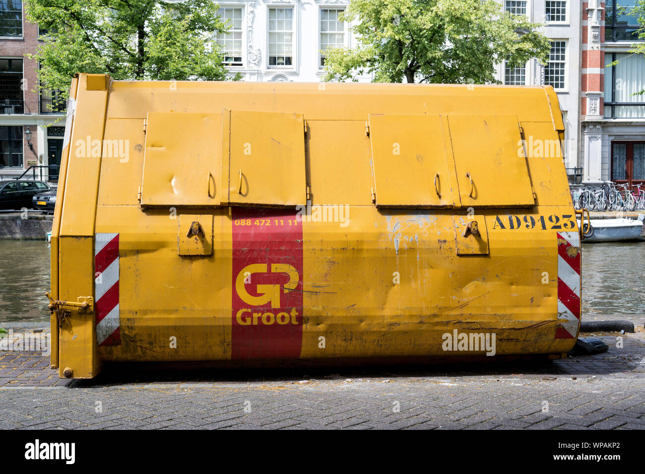 GP Groot roll-off container at canal Stock Photo - Alamy