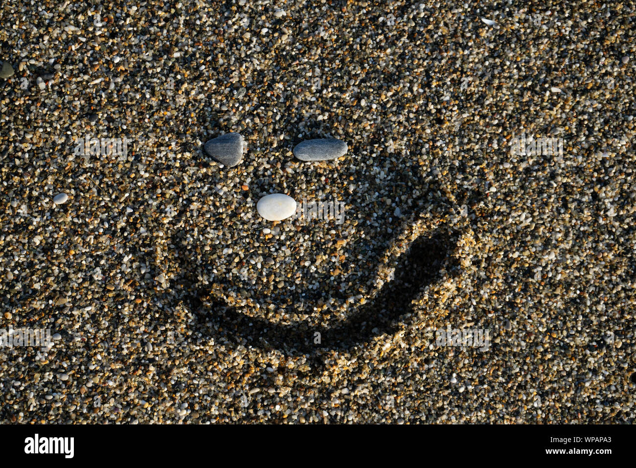 Smiley face on the beach hi-res stock photography and images - Alamy