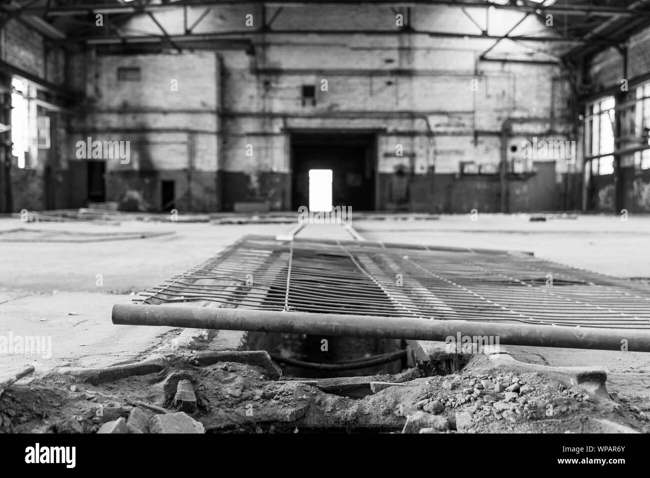 Low angle and close up view at falling metal fence lay on damage floor ...