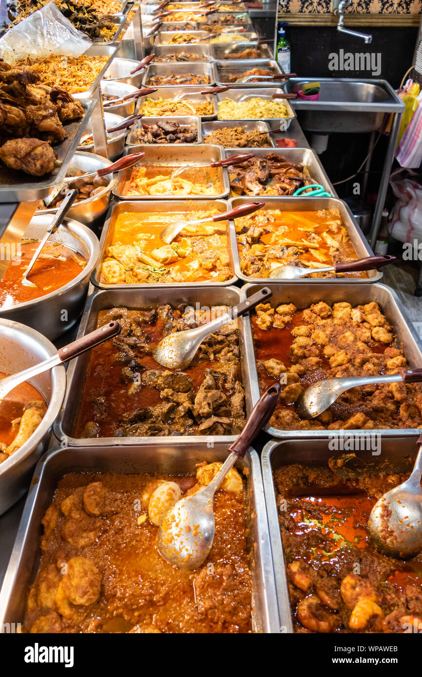 Variety of Burmese Myanmar curries in cooking trays Stock Photo - Alamy