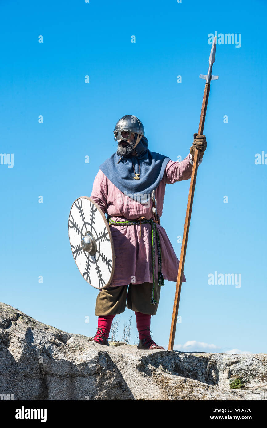 VIKING ON THE ROCKS with armor Stock Photo - Alamy