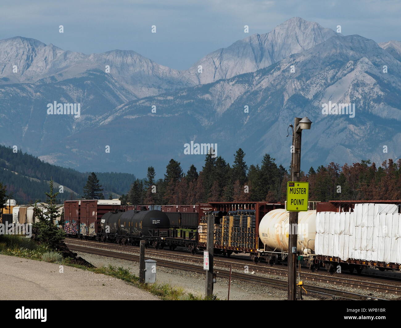 Freight train passing through Jasper, Alberta, Canada. Snow-capped ...