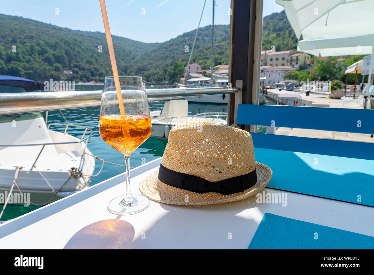 Tourist refreshment Drinking Cocktail long drink in the harbour bay ...