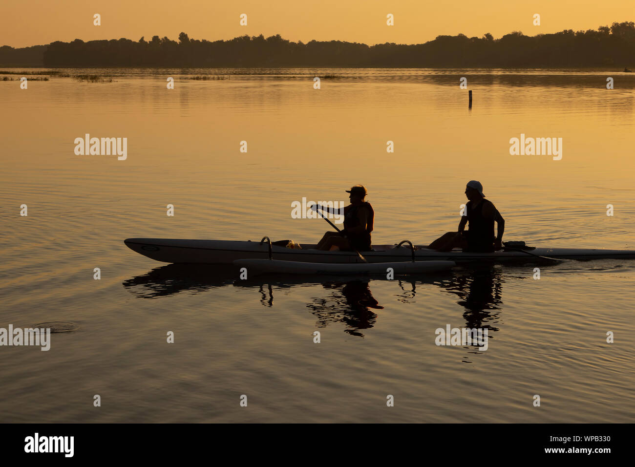 Paddling an outrigger canoe hi-res stock photography and images - Alamy