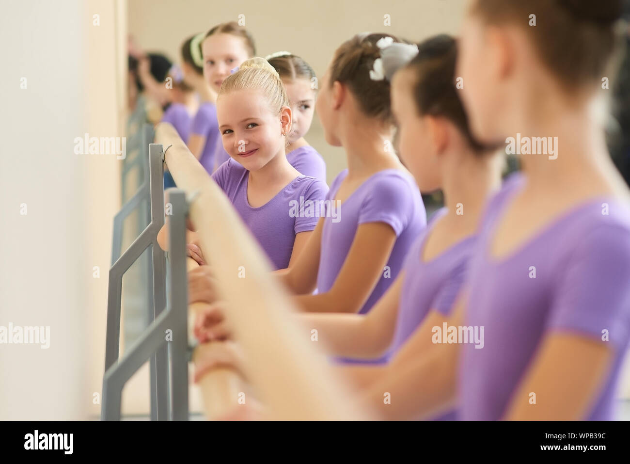 Happy smiling ballerina at ballet studio Stock Photo - Alamy