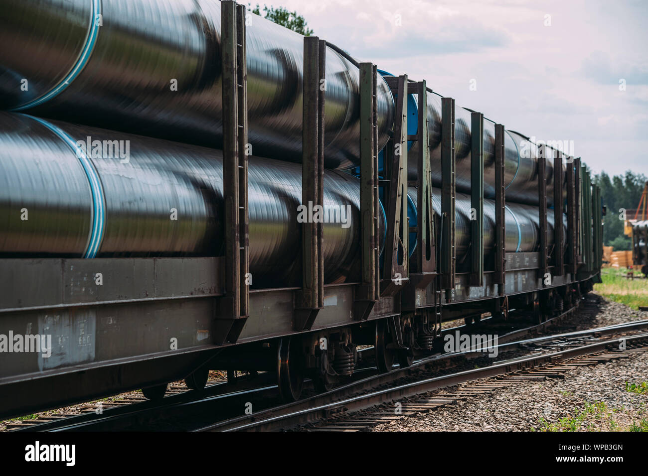 Freight train with new manufactured pipes selective focus Stock Photo ...