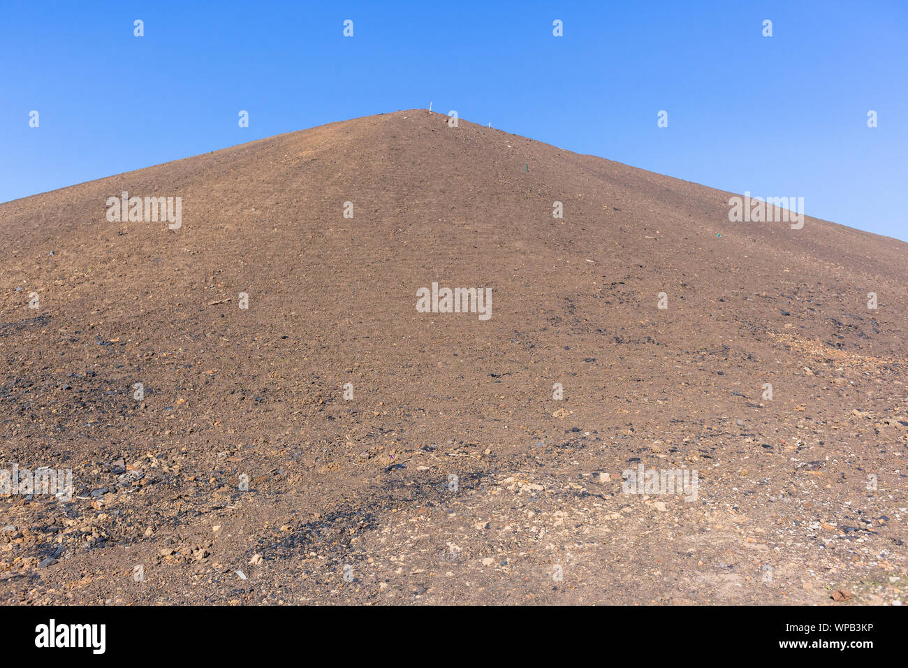 High brown sand texture steep embankment platform construction ...