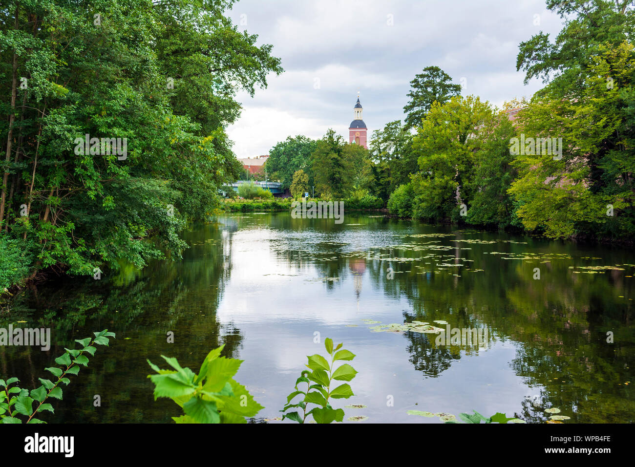 Ditch of the Spandau Citadel with the tower of St. Nicholas Church ...