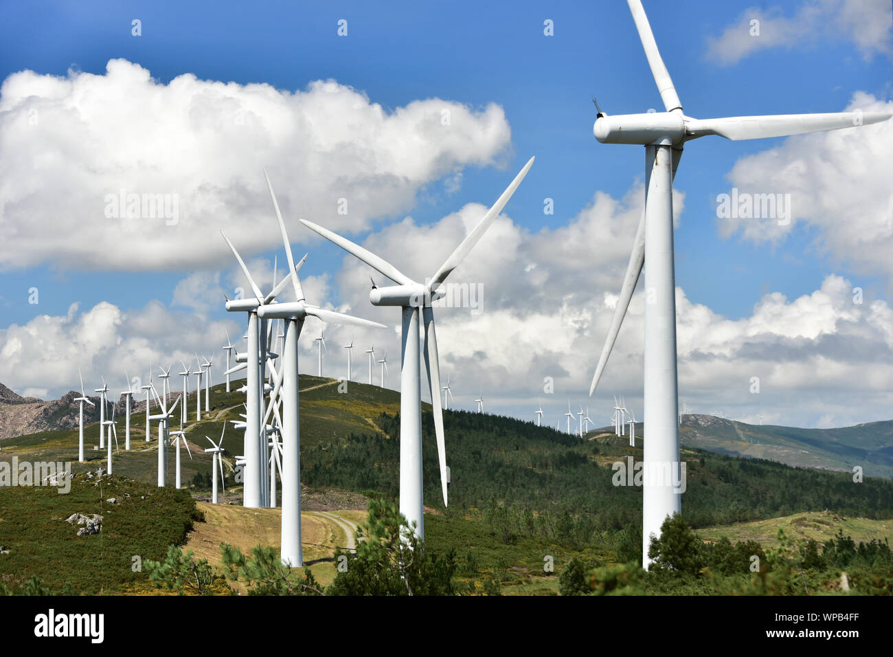 Wind power plant on hilltop in Europe Stock Photo - Alamy