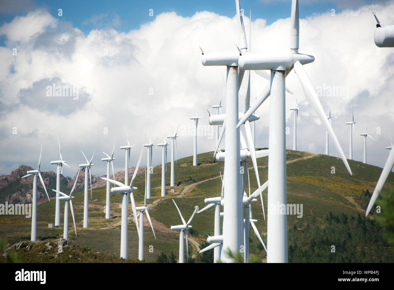 Wind power plant on hilltop in Europe Stock Photo - Alamy