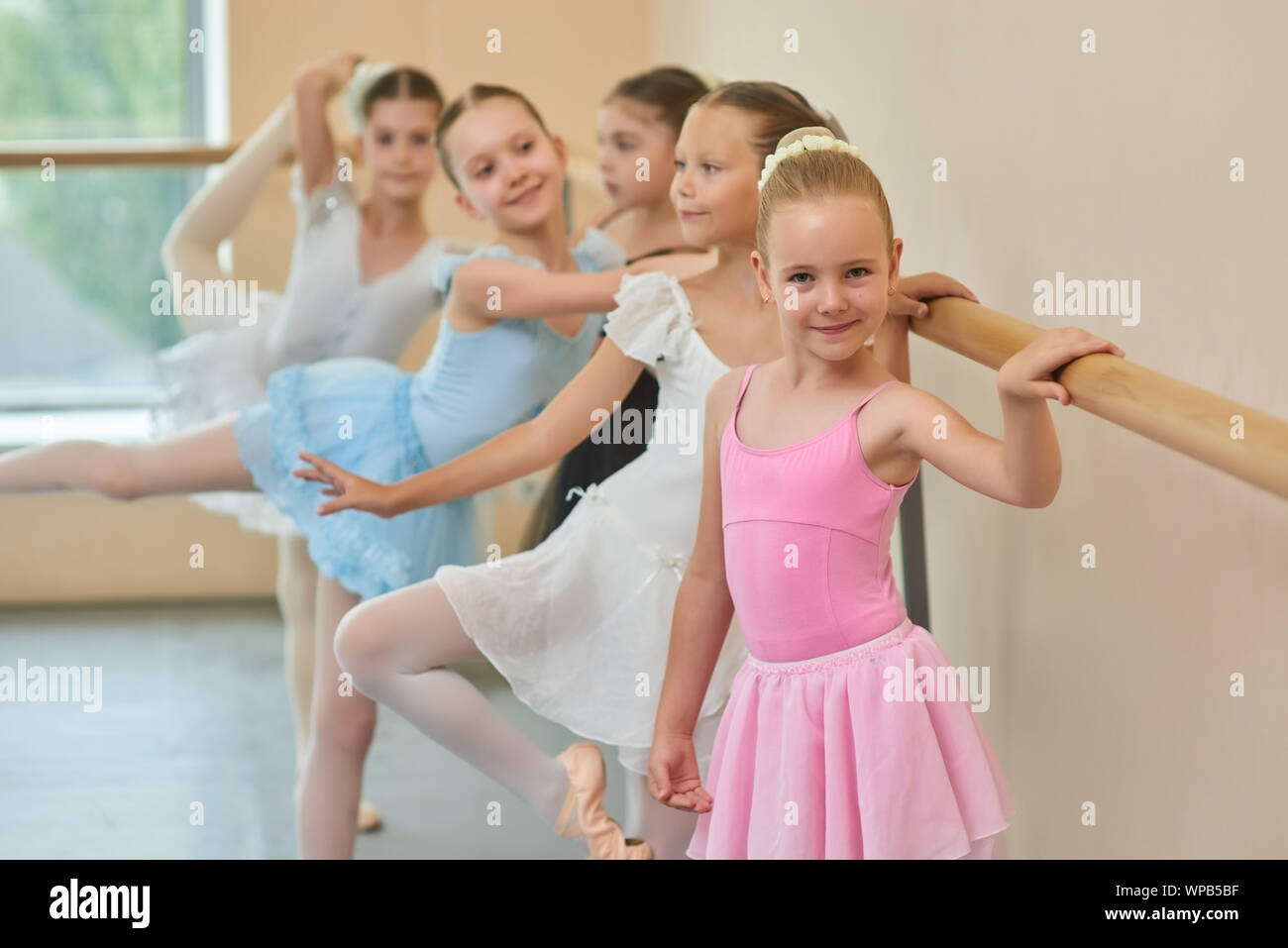 Happy smiling ballerina in pink suit Stock Photo - Alamy