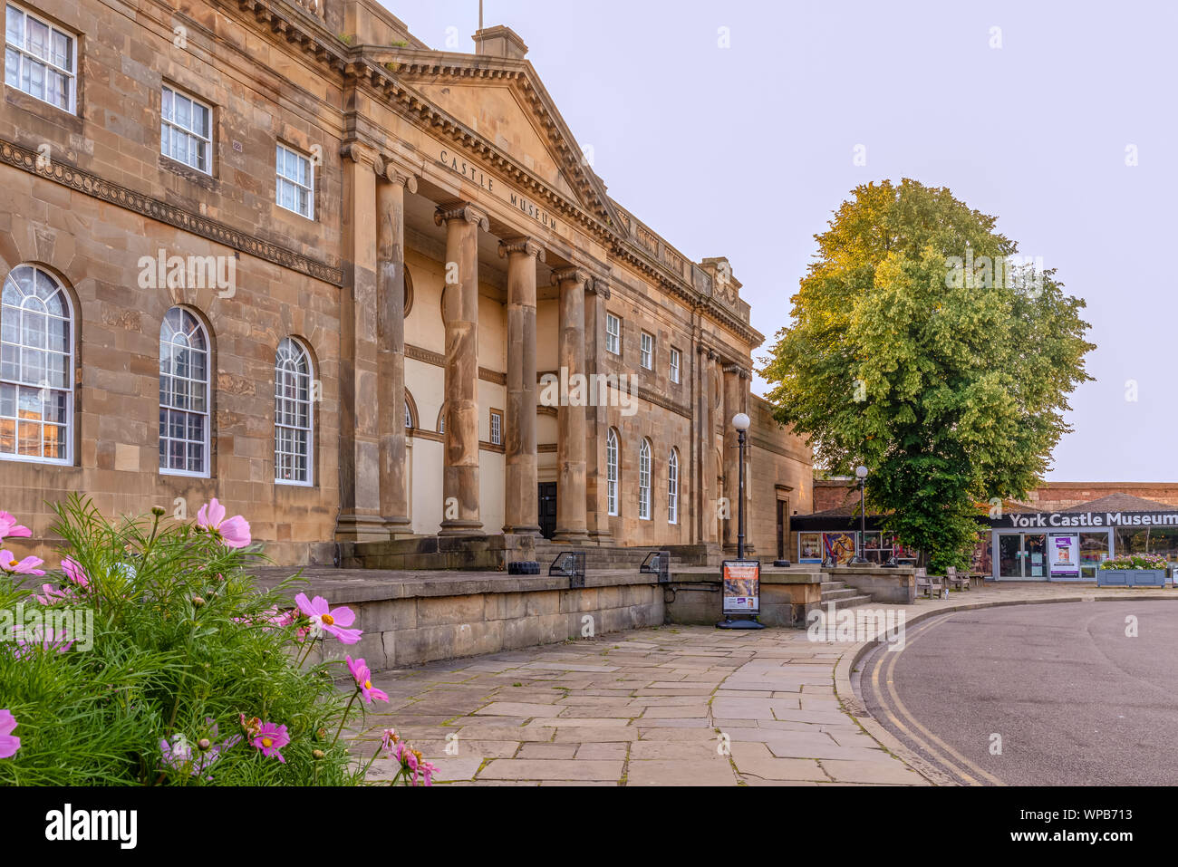 An 18th Century building made of stone with carvings and tall columns ...