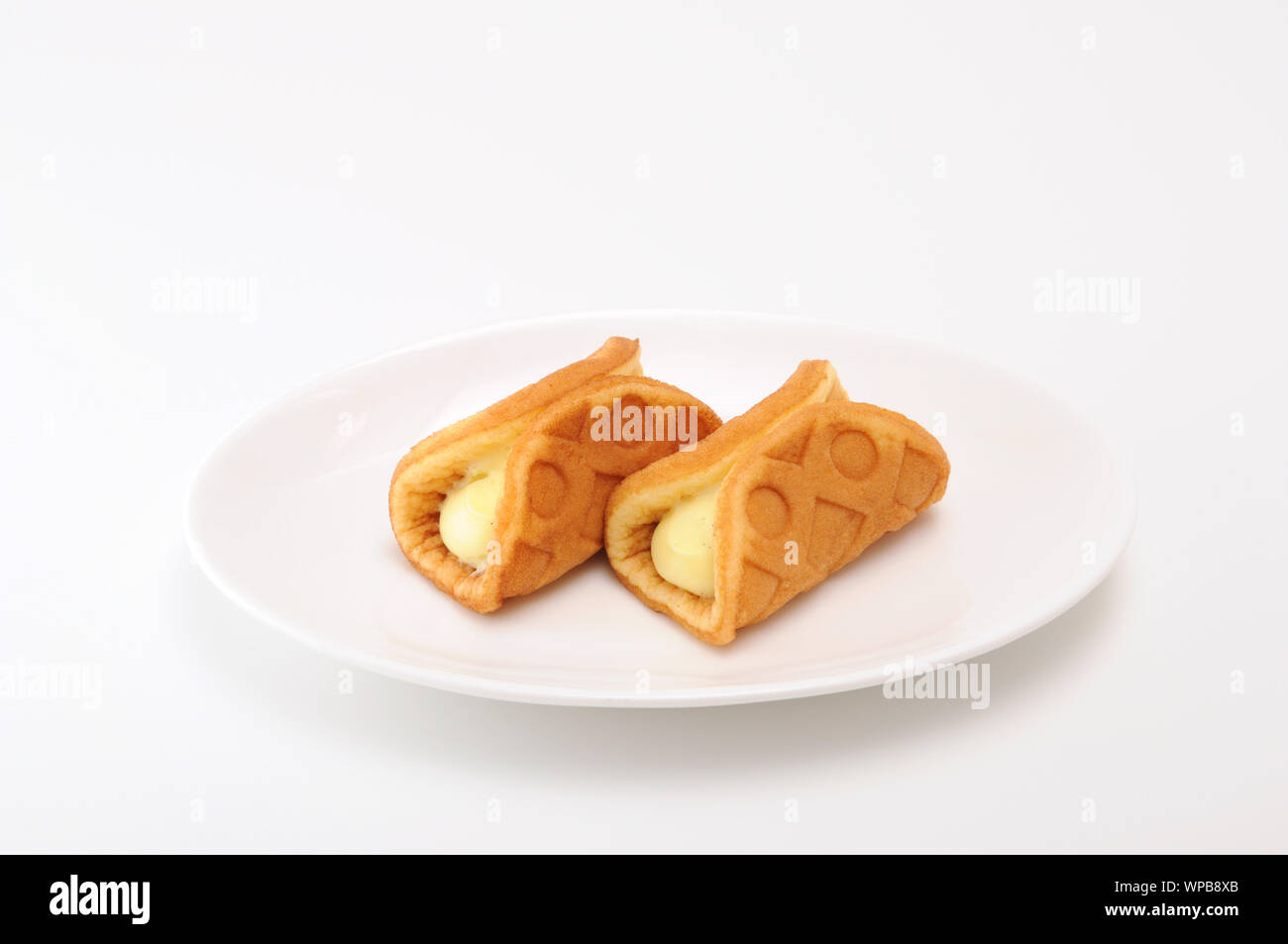 waffle custard cream roll on plate isolated on white background Stock ...