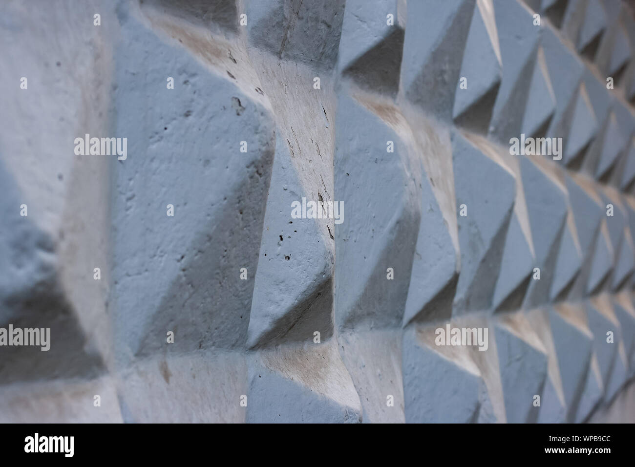 Abstract grunge background. Concrete faceted geometric figures of a ...