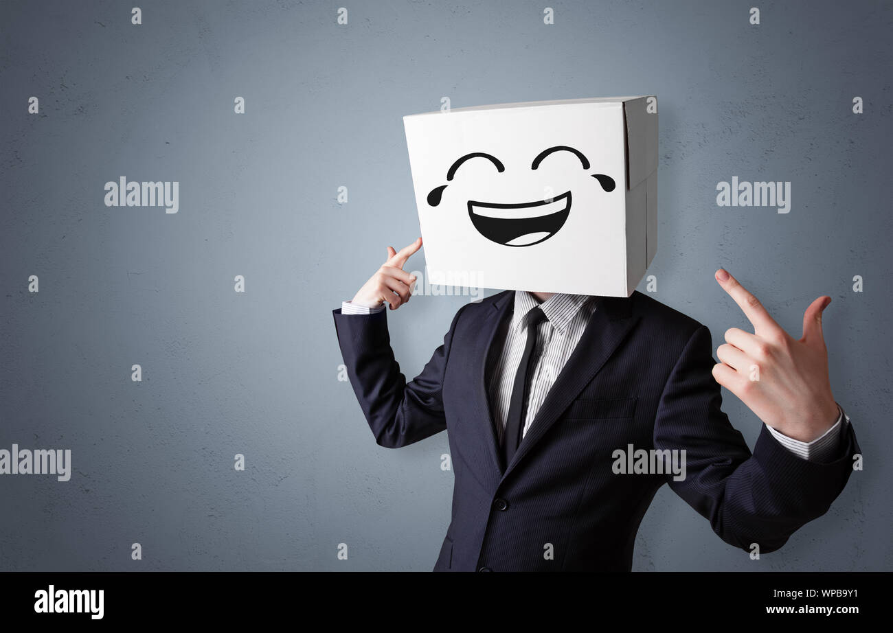 Funny man wearing cardboard box on his head with smiley face Stock ...